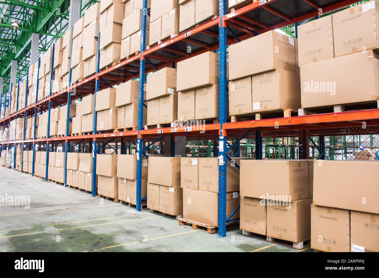 Rows of material boxes or product boxes in warehouse area Stock Photo ...