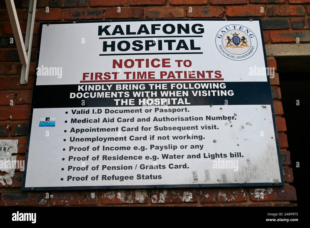 Sign with first time patient's instructions next to tuckshop outside ...