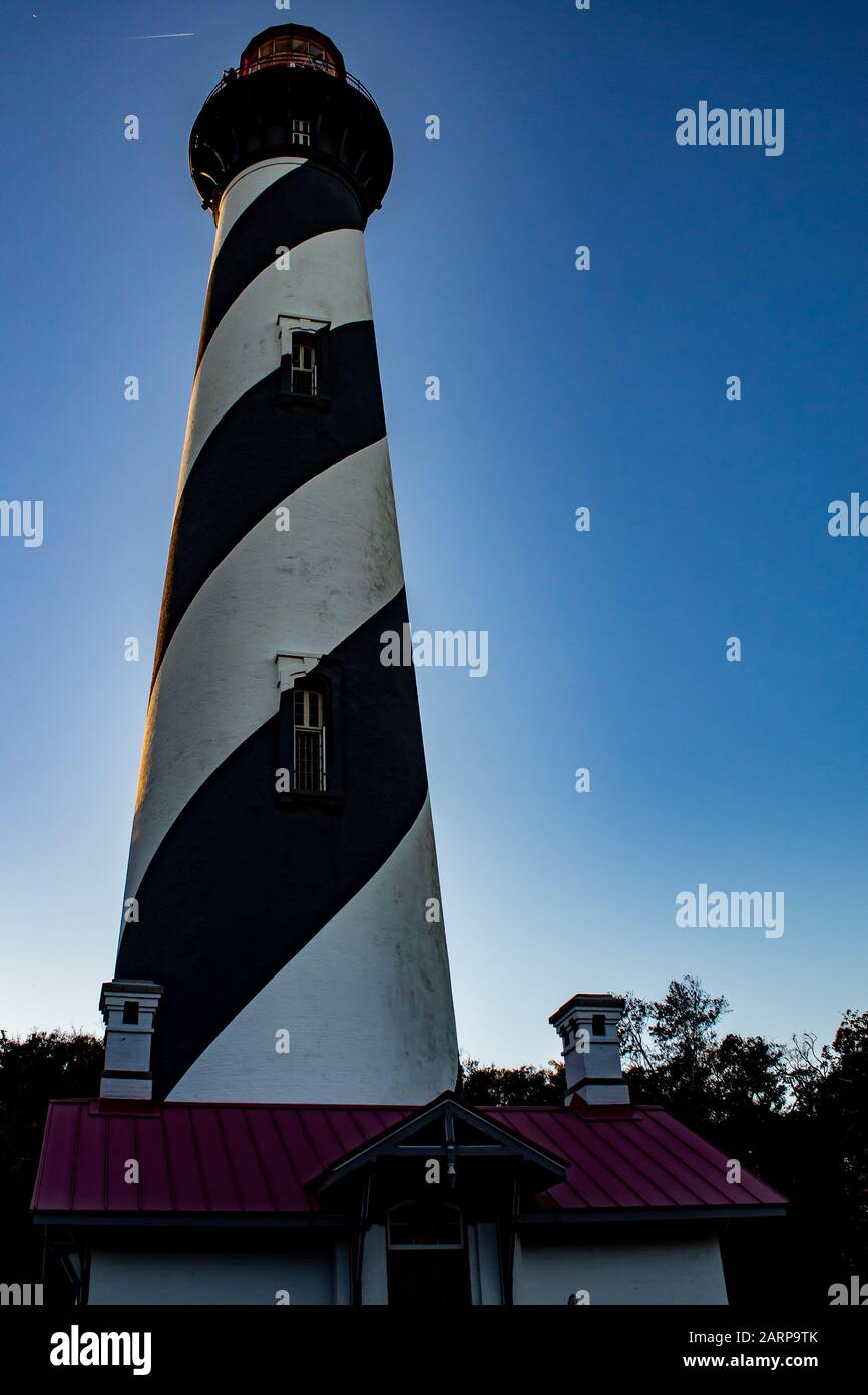 Black and white striped lighthouse in afternoon light Stock Photo - Alamy