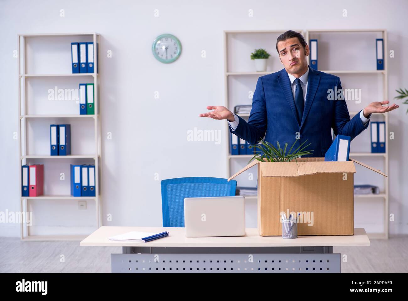 The young employee being made redundant Stock Photo - Alamy