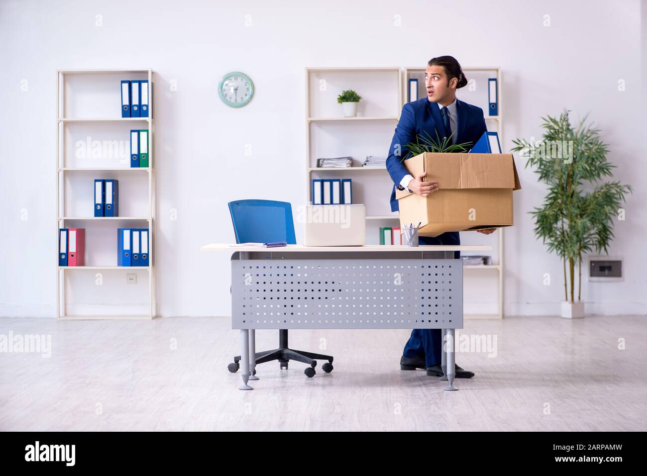The young employee being made redundant Stock Photo - Alamy