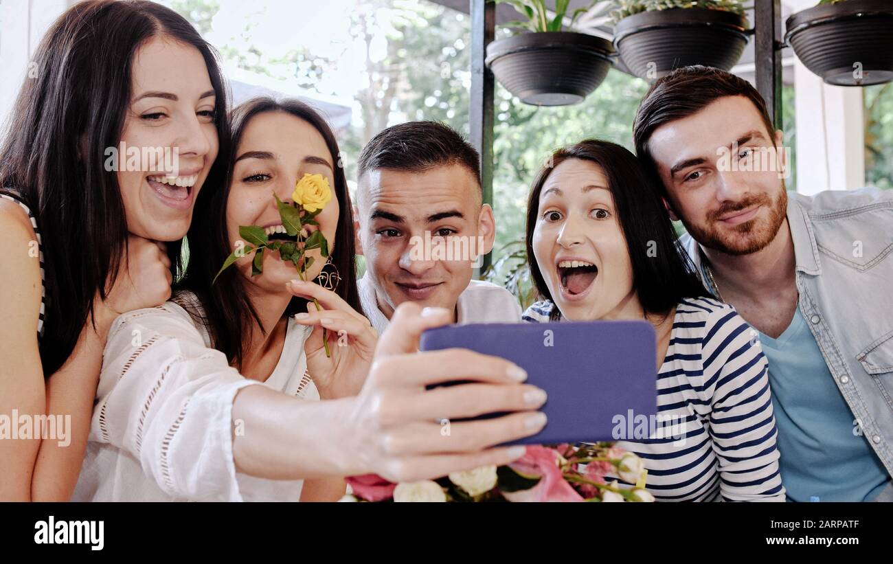 Group of friends makes selfie in at cafe Stock Photo - Alamy