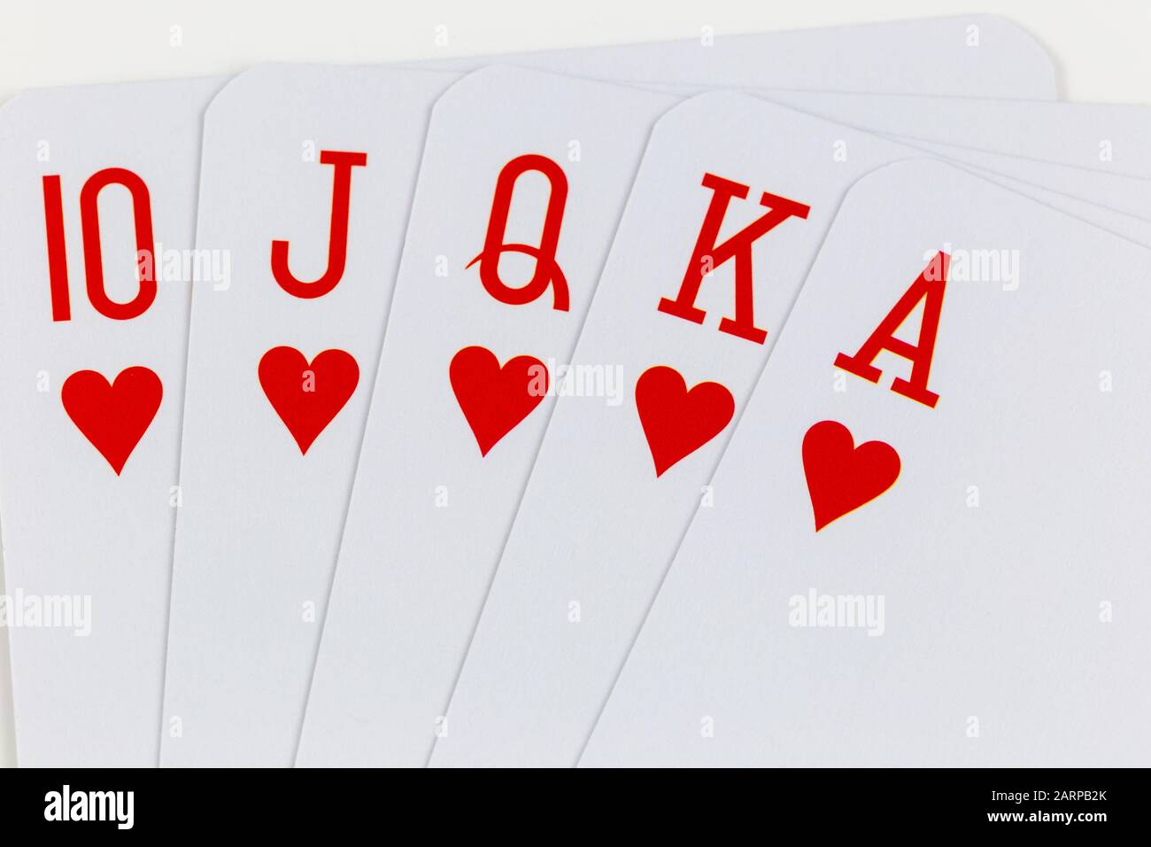 Playing cards, straight on white background macro photo Stock Photo - Alamy