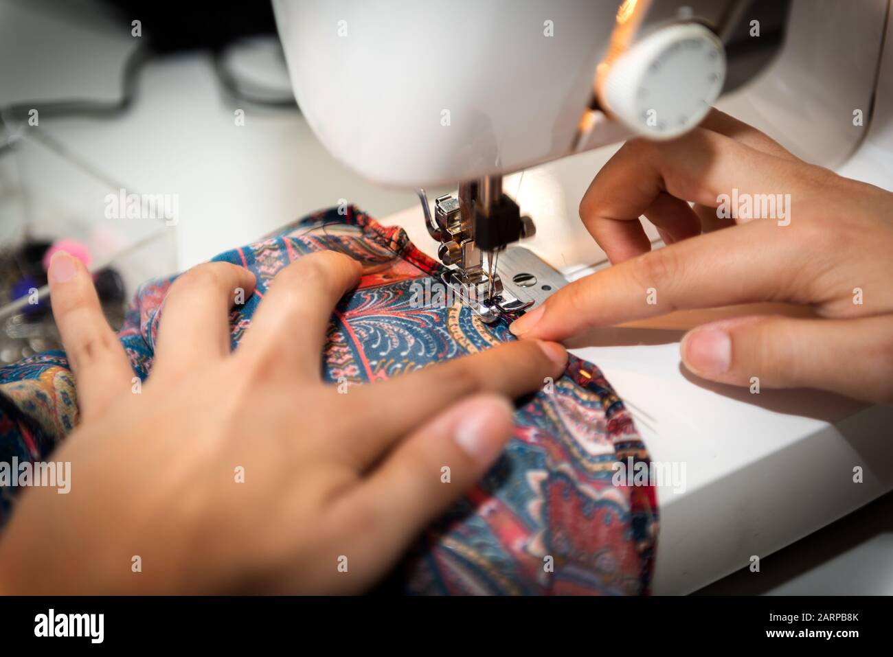 Tailoring Process - Women's hands behind her sewing Stock Photo - Alamy