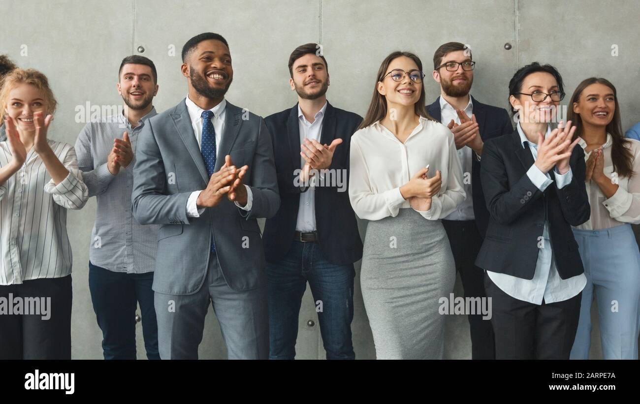 Diverse business colleagues clapping hands after meeting Stock Photo ...
