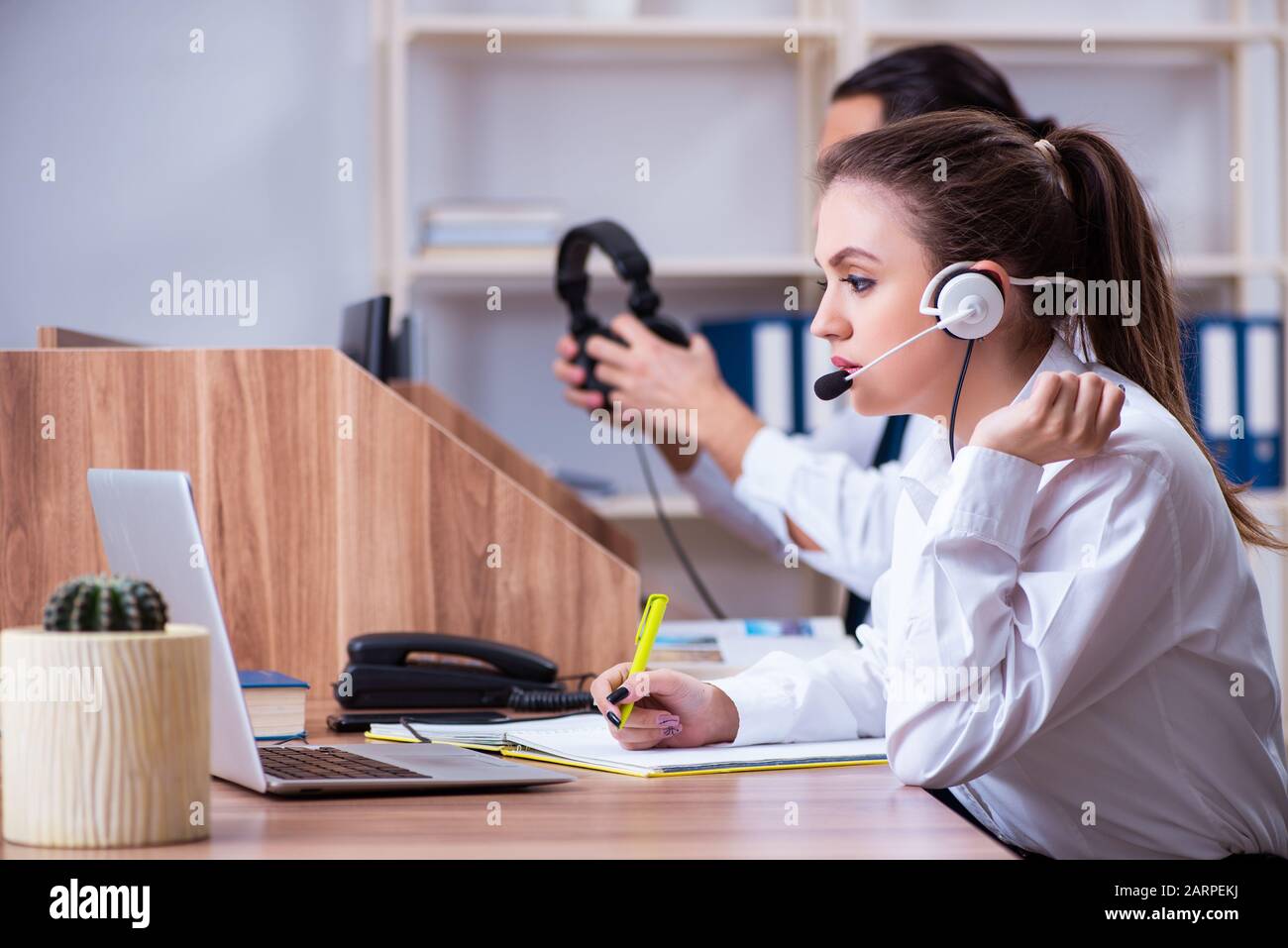 The call center operators working in the office Stock Photo - Alamy