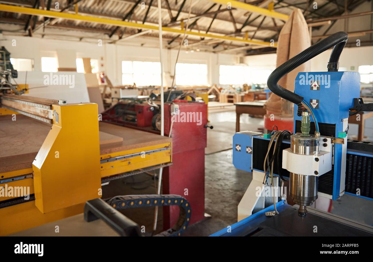Large industrial machinery inside of a woodworking shop Stock Photo - Alamy