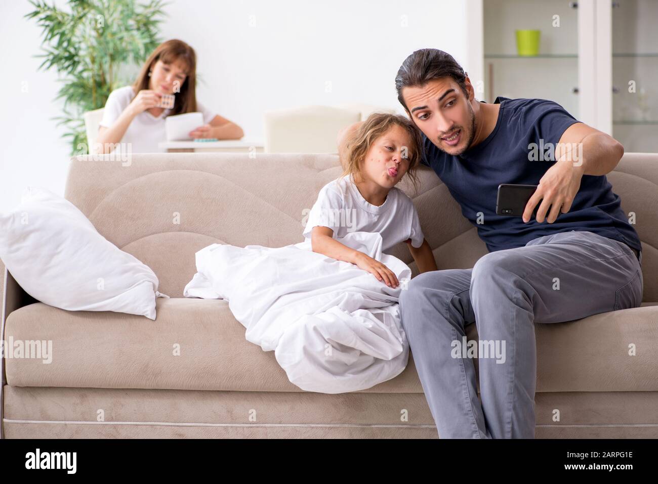 The father taking care of his ill daughter Stock Photo - Alamy