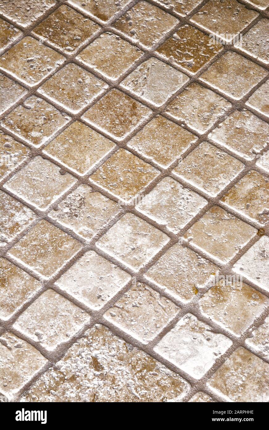 Close up of a new ceramic tile wall using various size tiles creating a ...