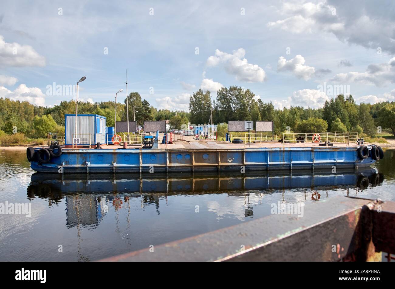 Blue berth for the ferry on the river Stock Photo - Alamy
