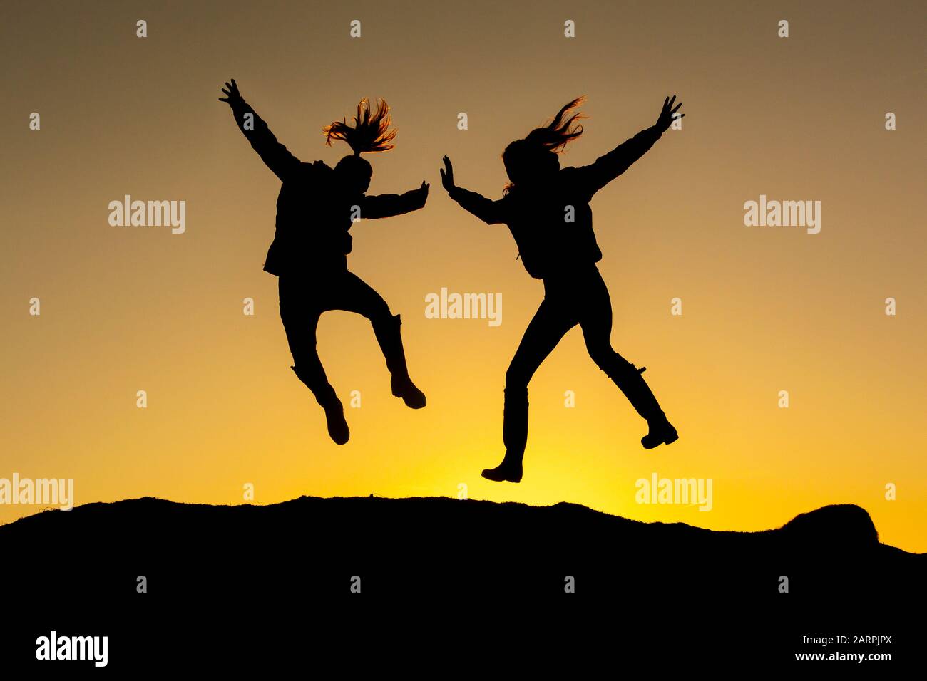Children jumping for joy silhouette hi-res stock photography and images ...