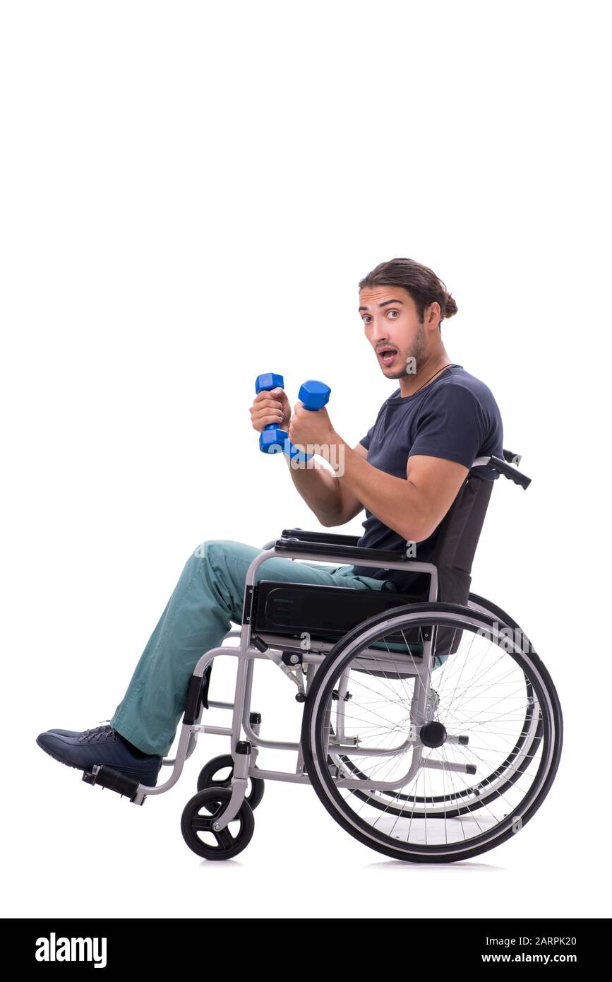 The young disabled man doing physical exercises isolated on white Stock ...