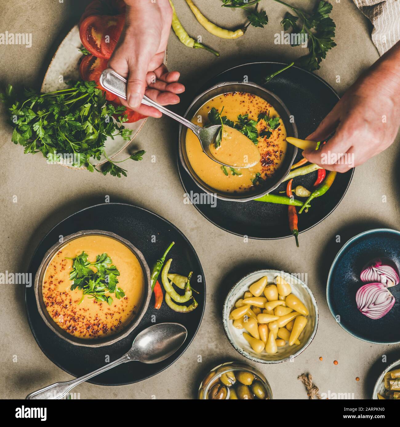 Man eating turkish traditional lentil soup Mercimek with pickled ...
