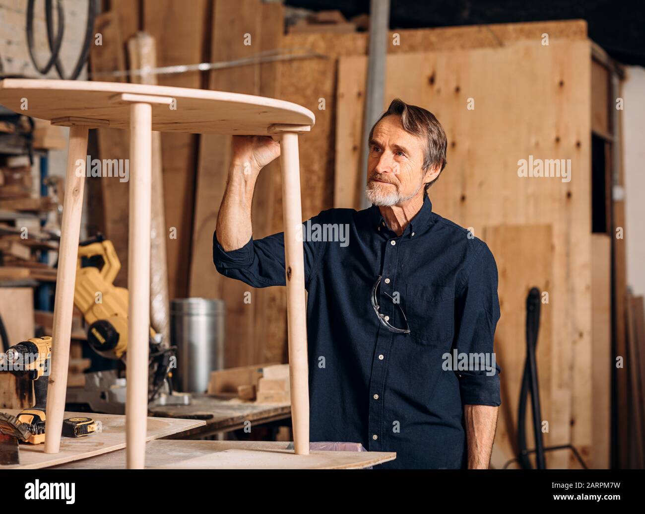 Furniture workshop man standing workbench hi-res stock photography and ...