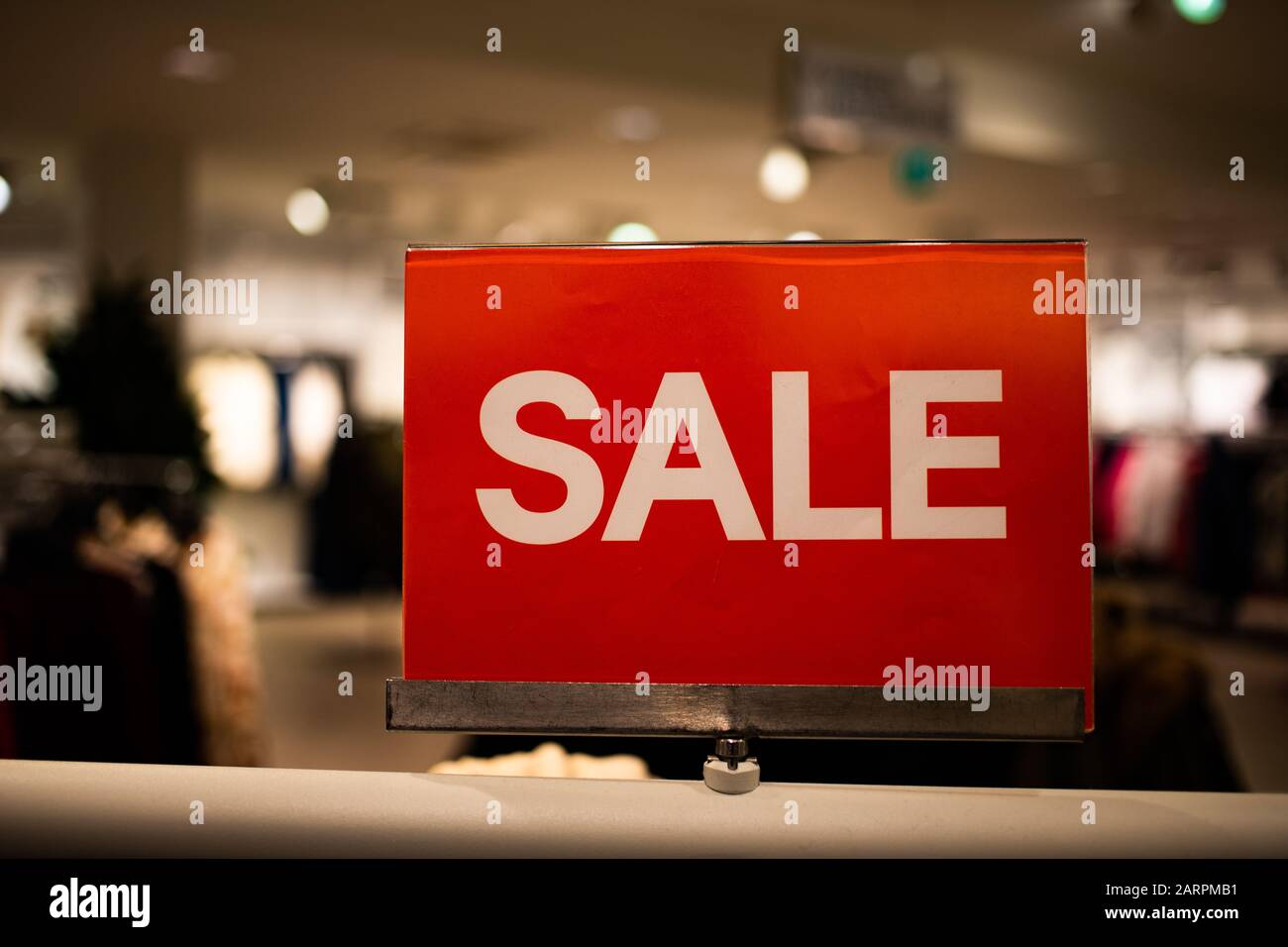 red sale sign in a shop january sales Stock Photo - Alamy