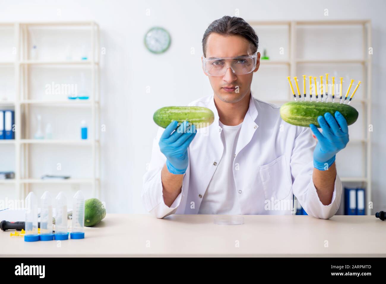 The male nutrition expert testing vegetables in lab Stock Photo - Alamy
