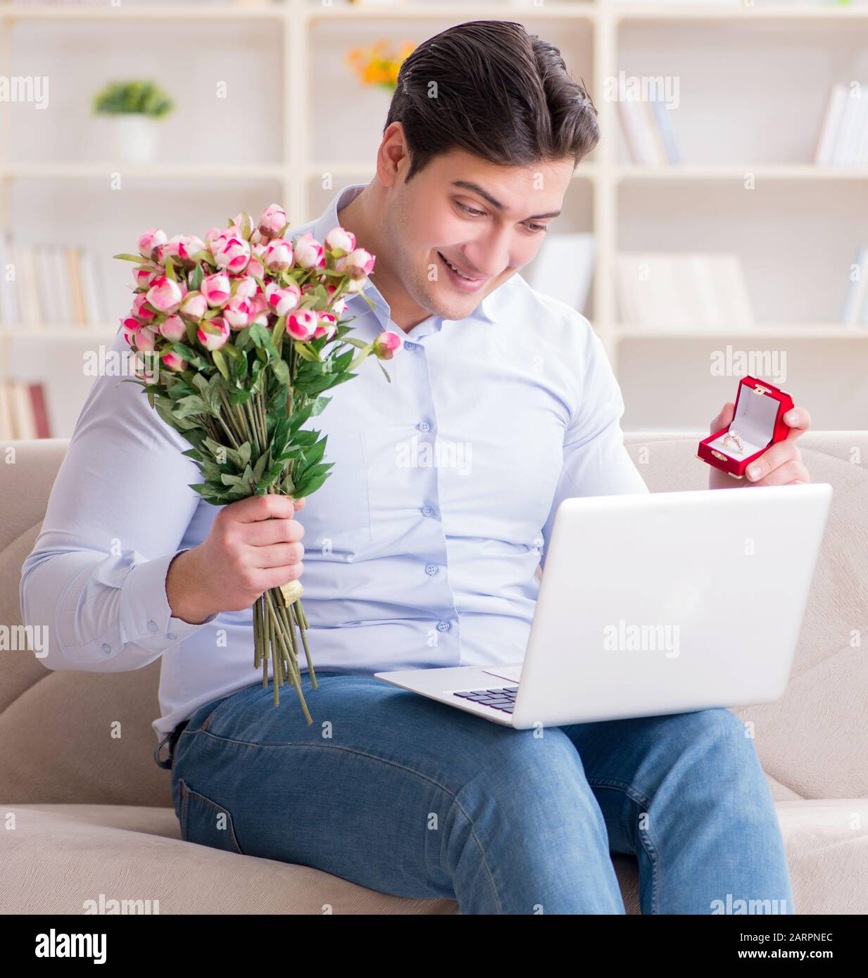 Young man making marriage proposal over internet laptop Stock Photo - Alamy