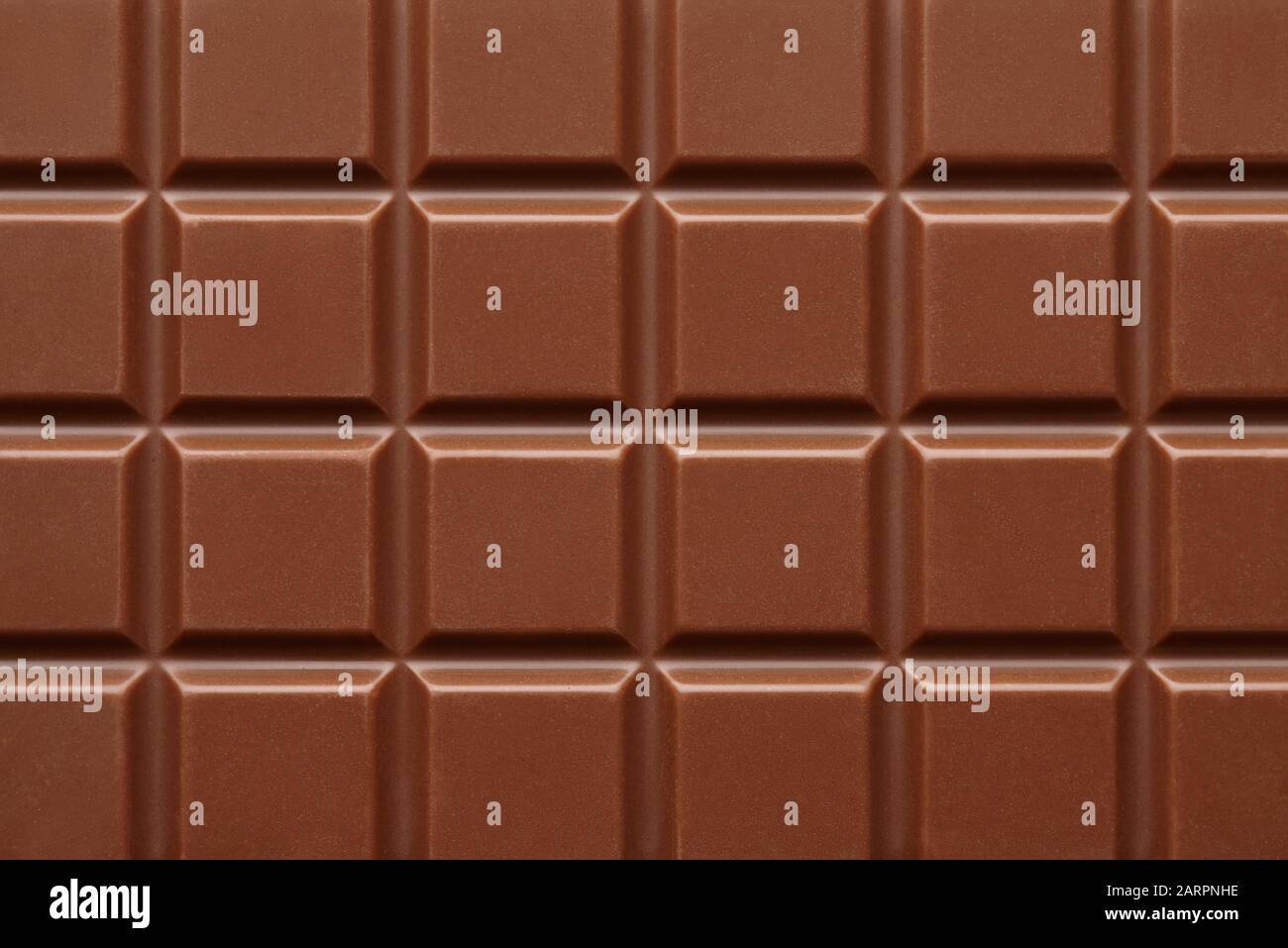 Milk chocolate bar background, close up view Stock Photo - Alamy