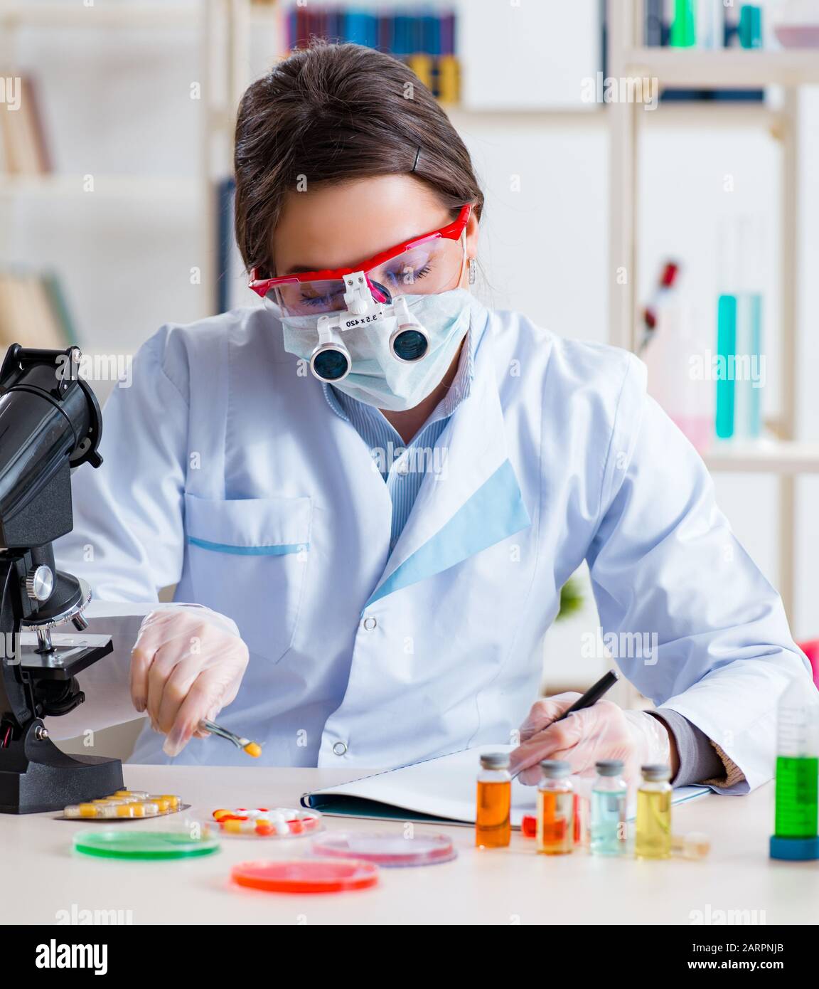 The lab assistant in drug synthesis concept Stock Photo - Alamy