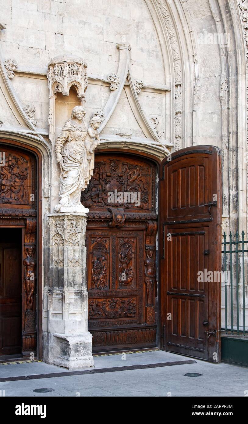 ornate carved wood doors, walnut, old, St. Pierre Basilica; intricate ...