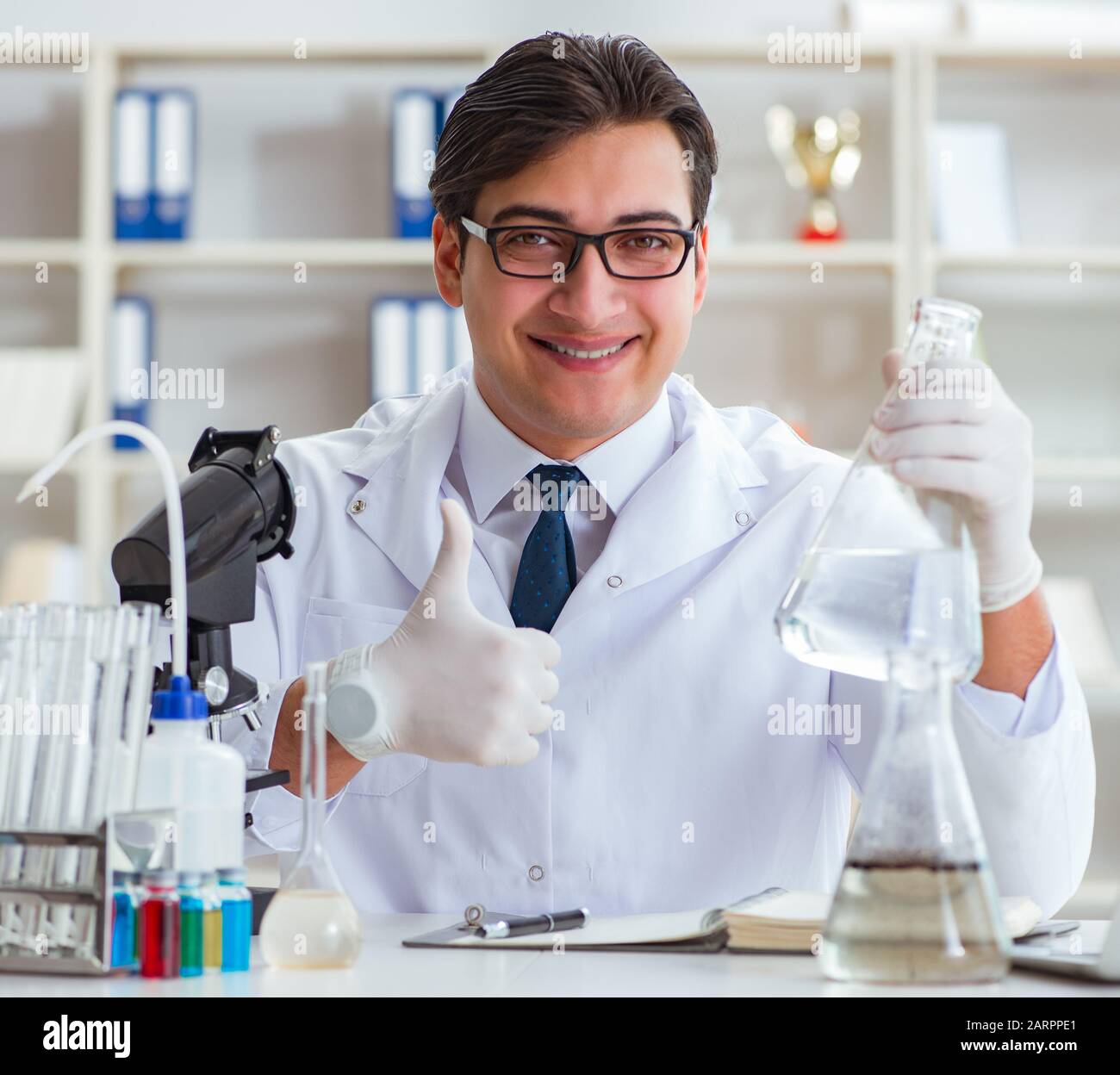 Young researcher scientist doing a water test contamination experiment ...