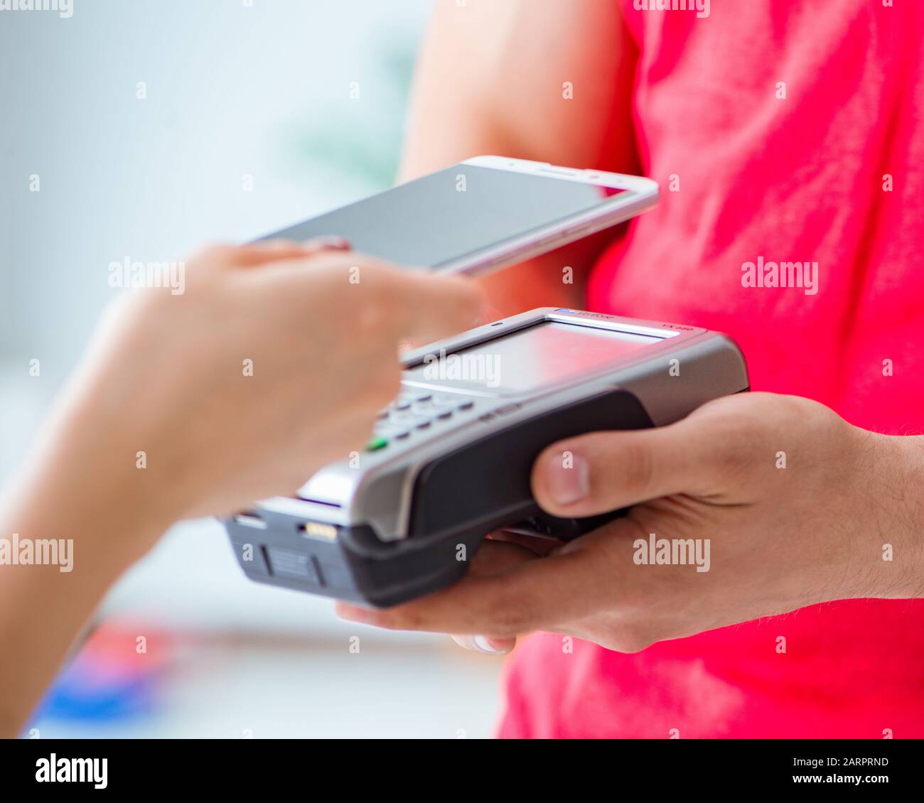 The concept of paying with pos terminal Stock Photo - Alamy
