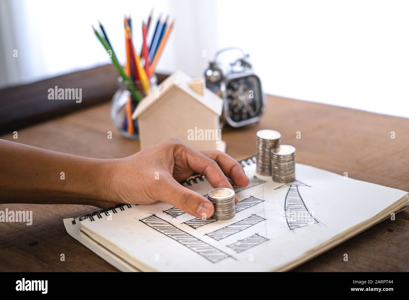 Money growing concept-Money and income graph drawing On Home office ...