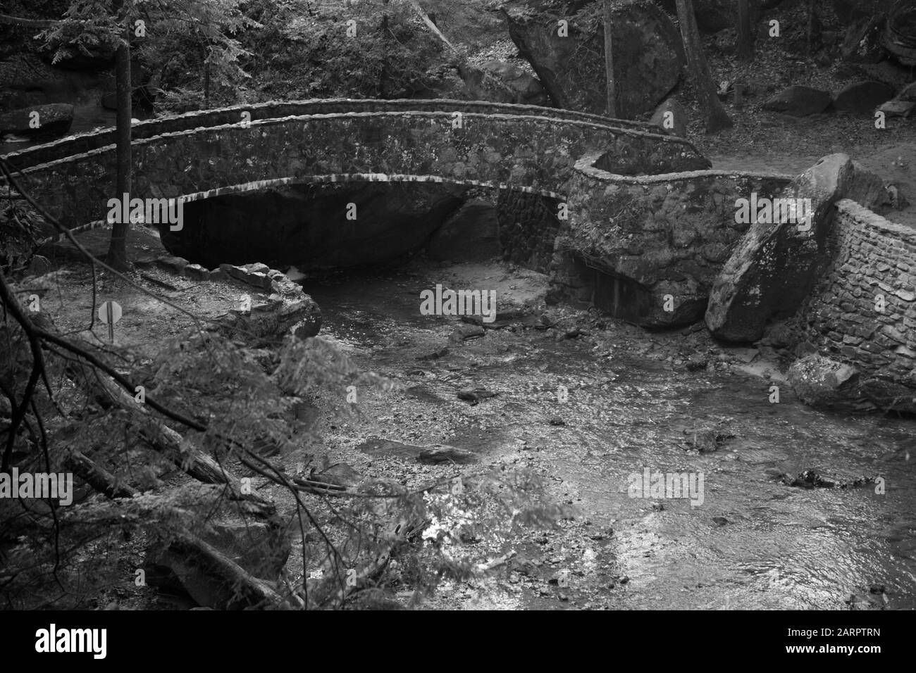 Arched stone bridge over a stream Stock Photo - Alamy