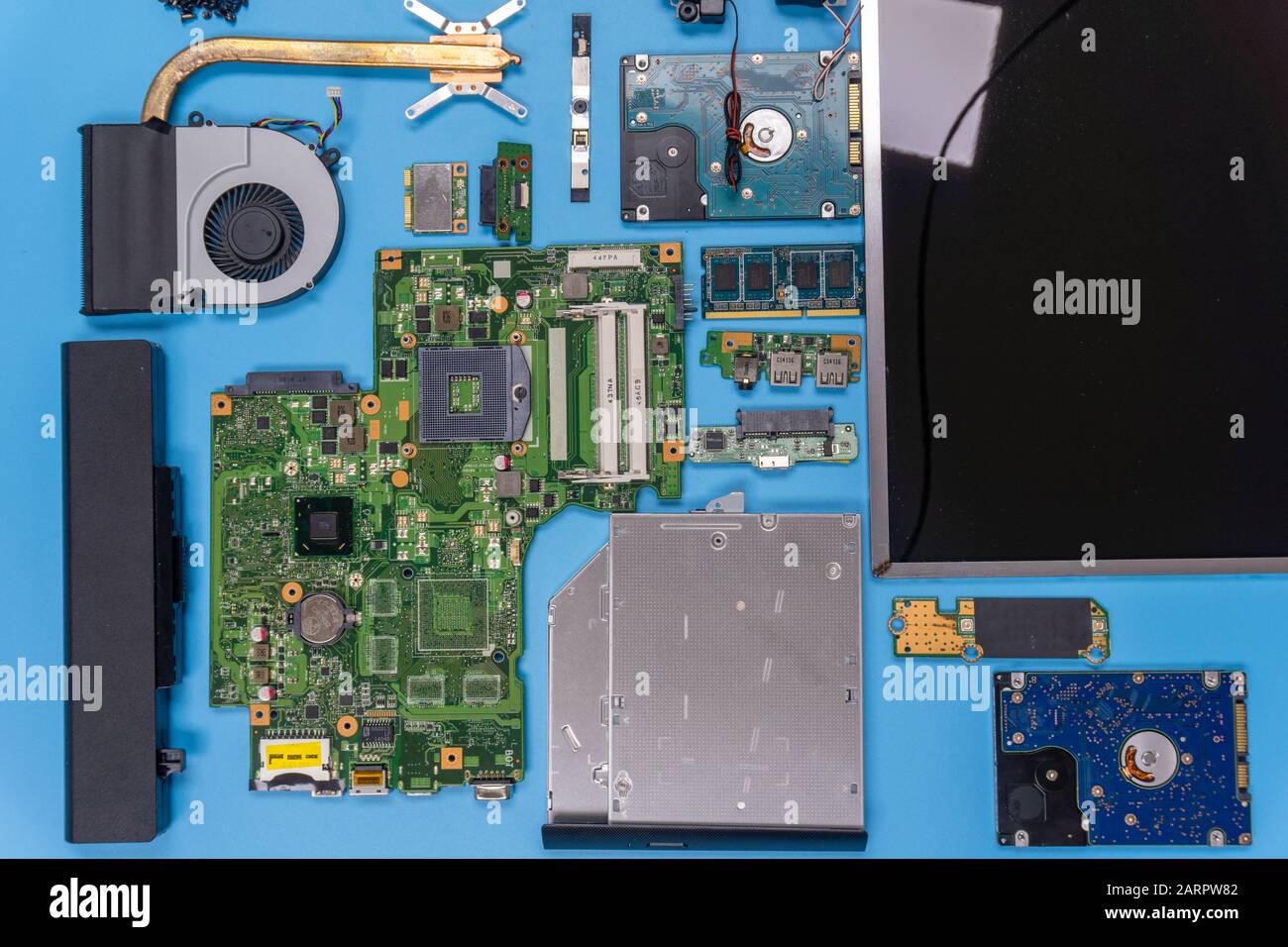 Parts of a modern computer. The insides of a laptop on a blue ...