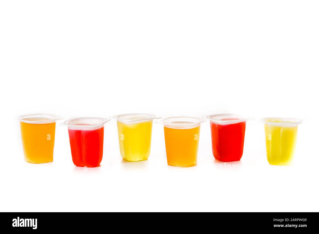 jellies of different flavors and colors isolated on white background ...