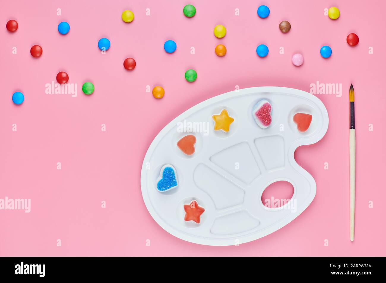 Art of sweetmeats concept, copy space. Sweet candy in paint palette on ...