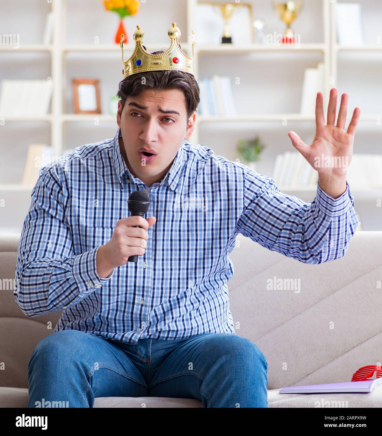 The funny man singing songs in karaoke at home Stock Photo - Alamy