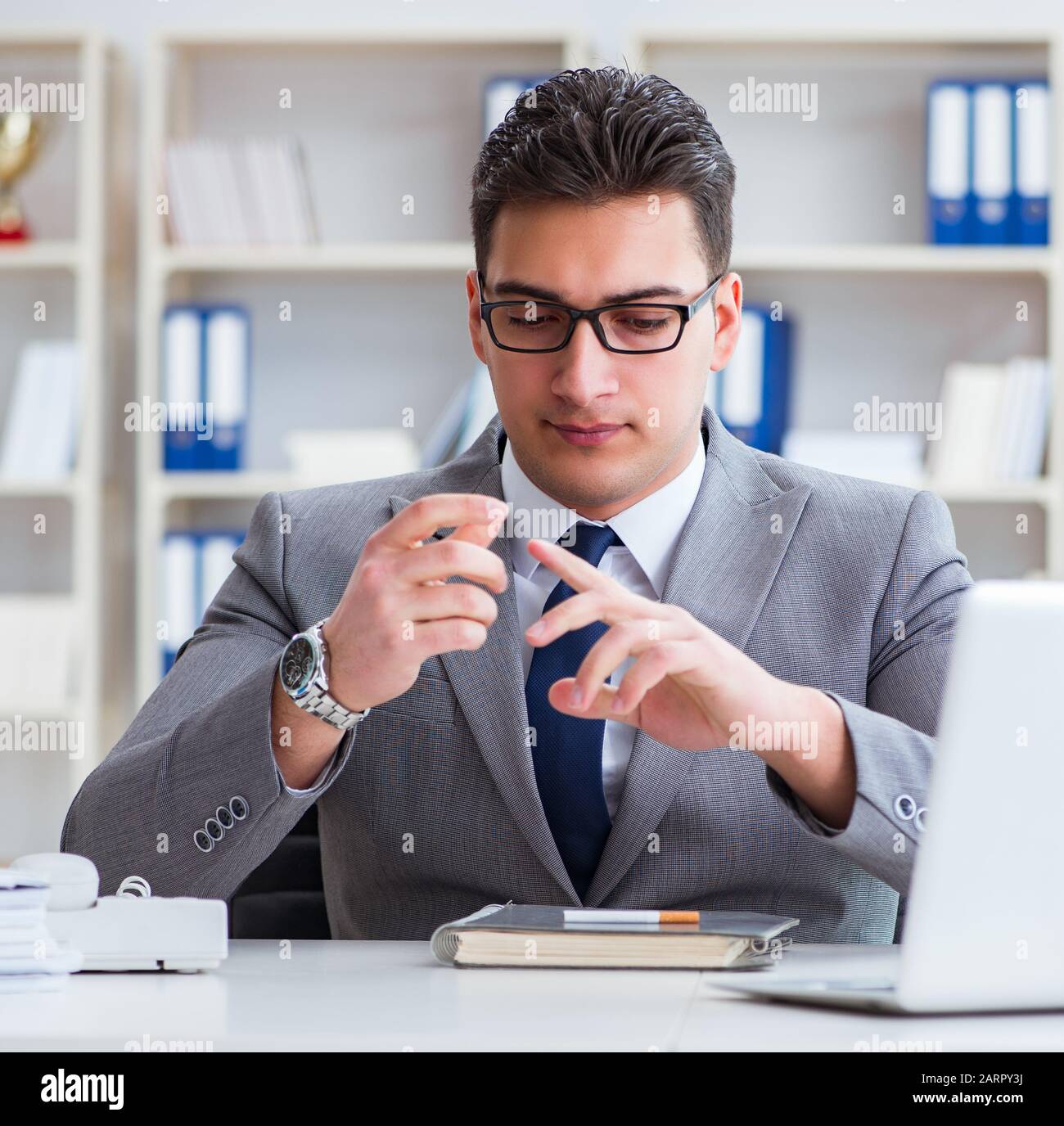 The businessman smoking in office at work Stock Photo - Alamy