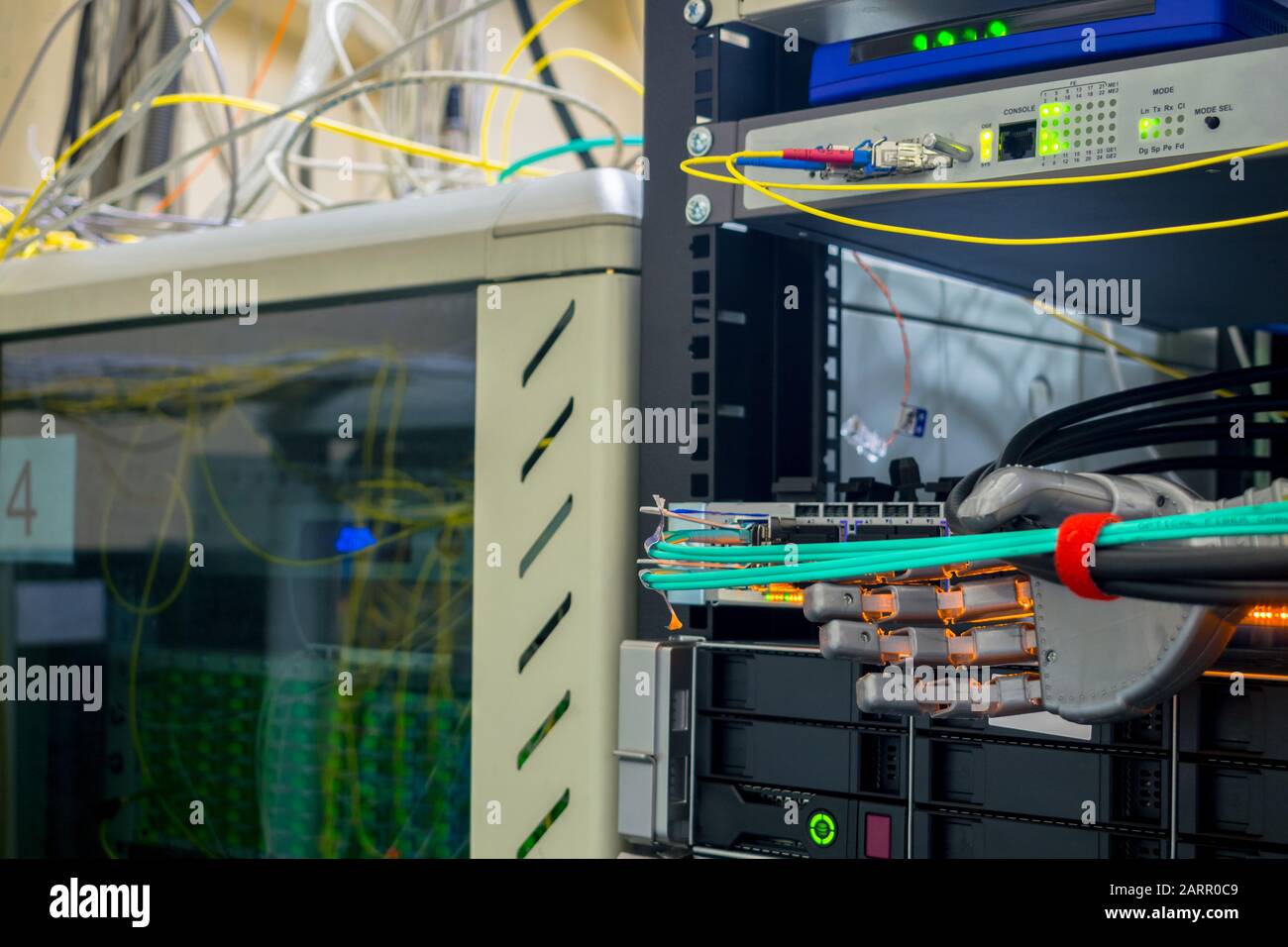 An artificial metal arm performs work in the server room. The robot ...