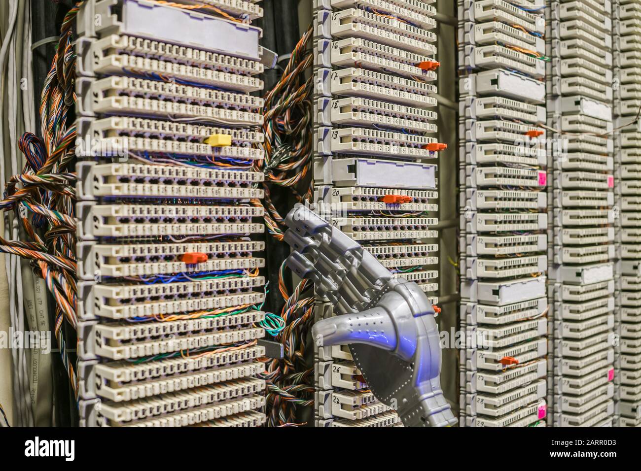 A mechanical hand is next to the ip telephony patch panel. The robot ...