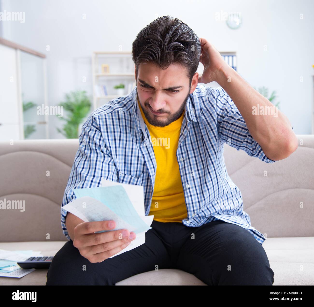 The man angry at bills he needs to pay Stock Photo - Alamy
