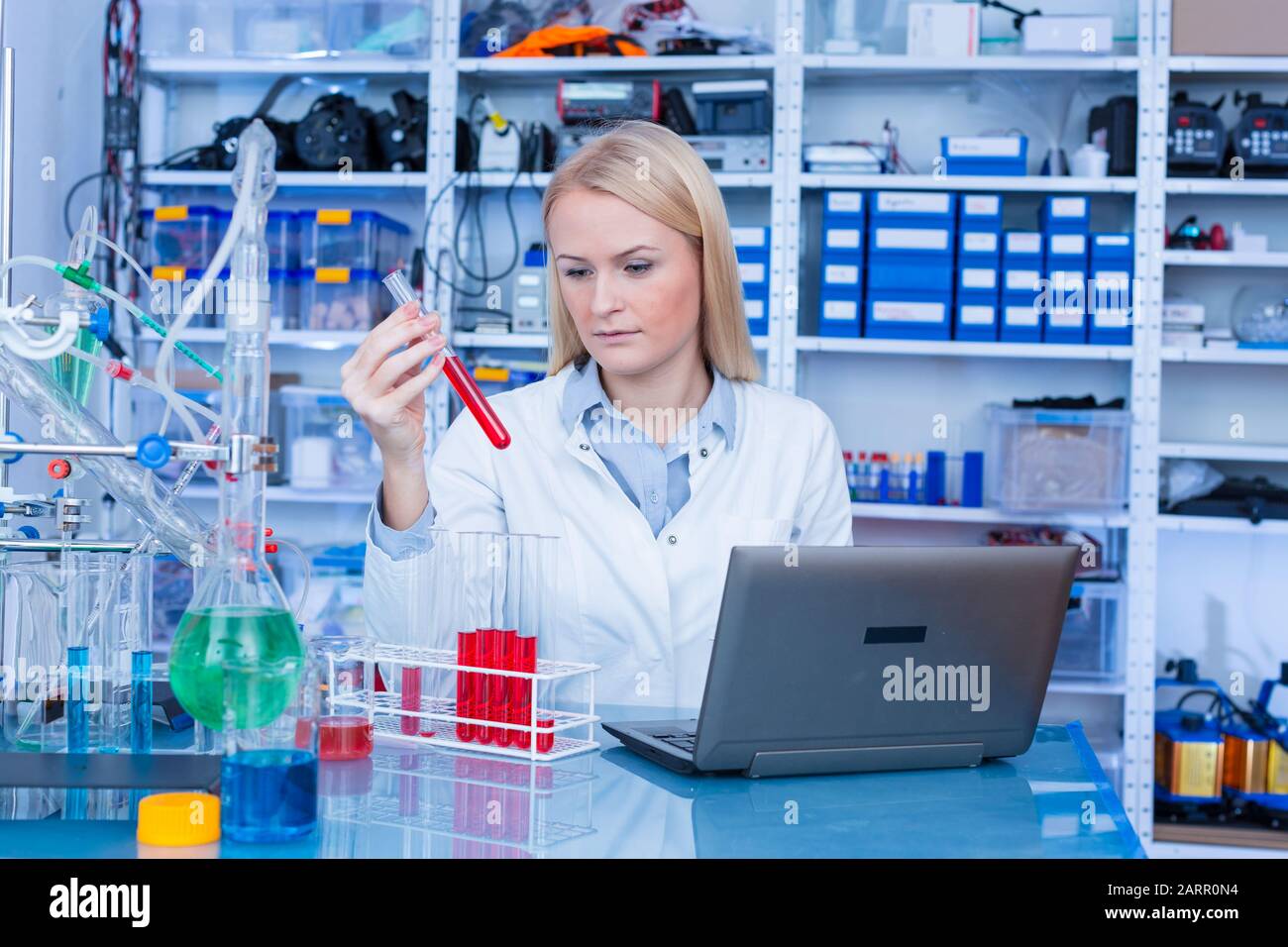 Girl laboratory Assistant works with an antiviral drug in a ...