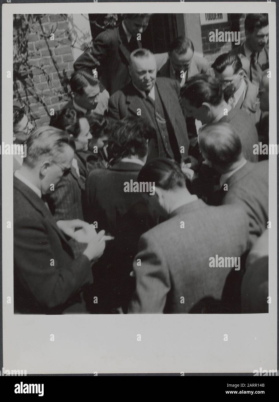 War, liberation and capitulation II Journalists surround a man Stock ...
