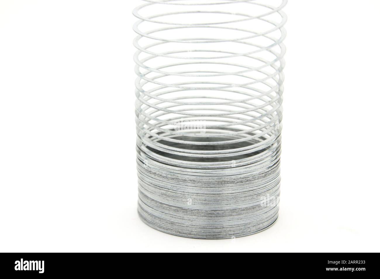 original metal slinky stretched rainbow Stock Photo - Alamy