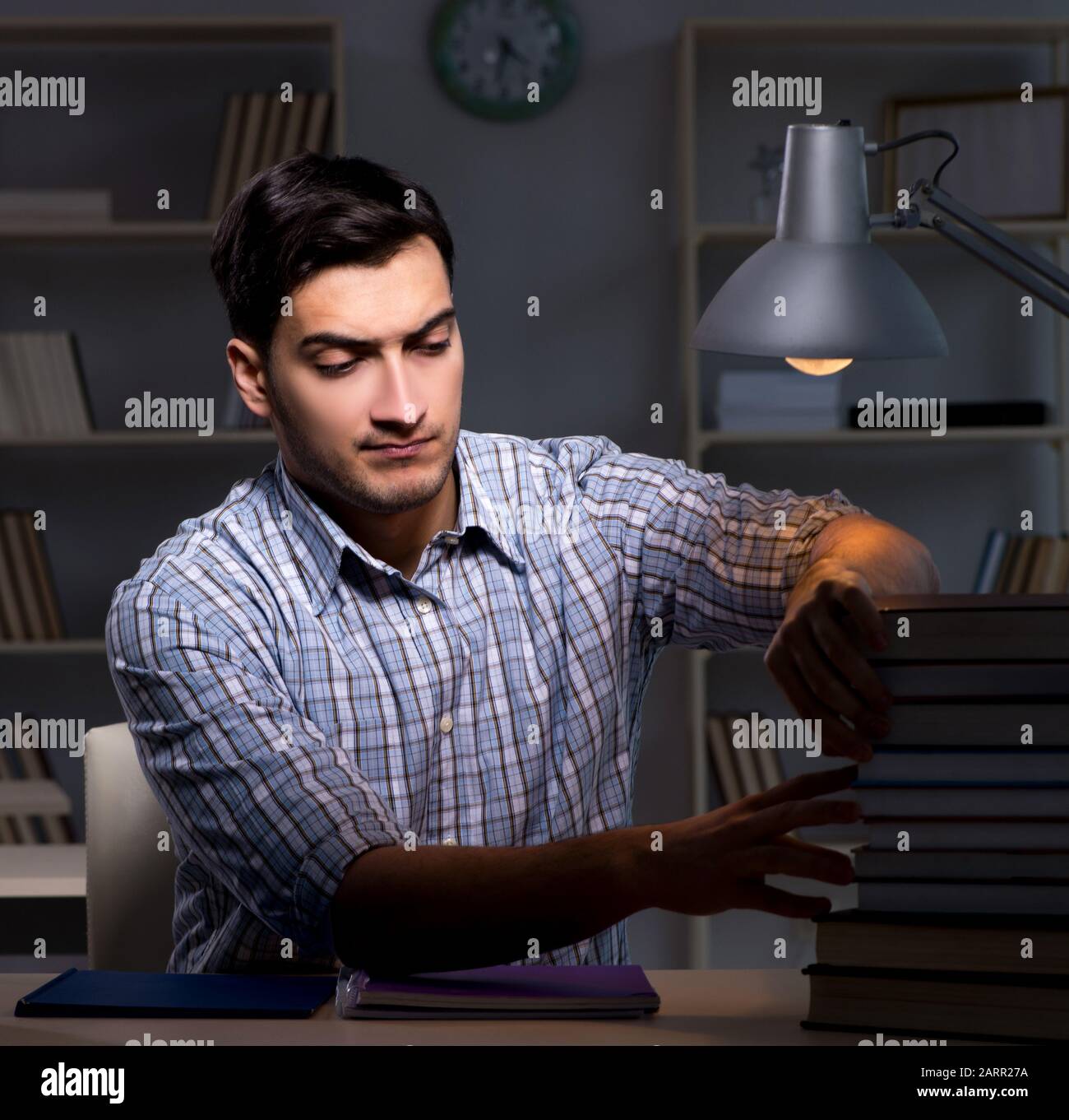 The student preparing for exams late at night Stock Photo - Alamy