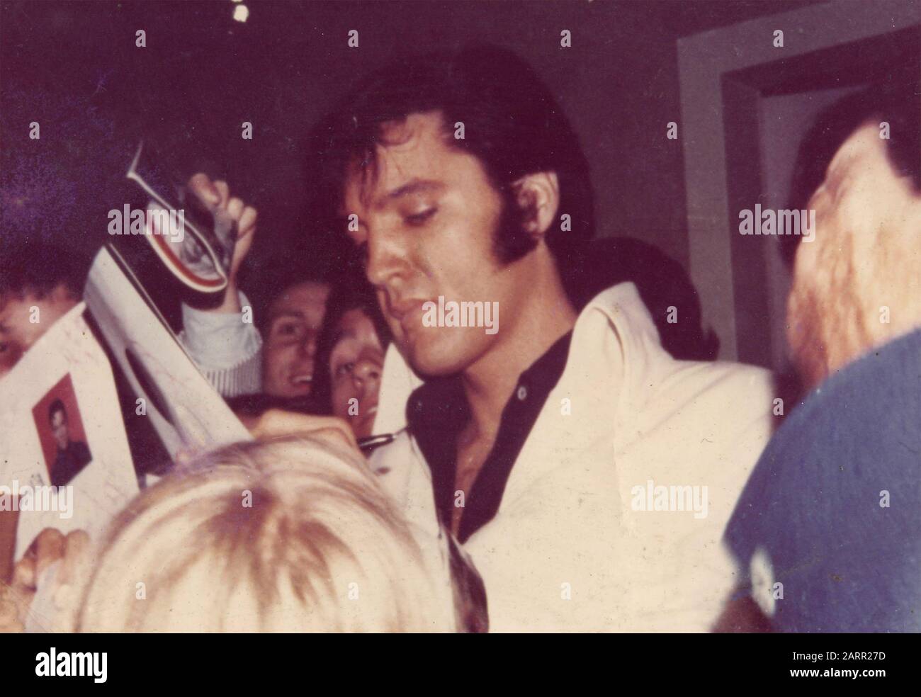 American singer and actor Elvis Presley signing autographs to fans, USA ...