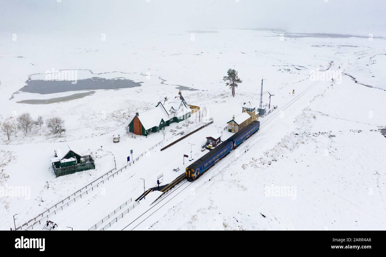 Corrour Station and train in snow .It is the highest station in Britain ...