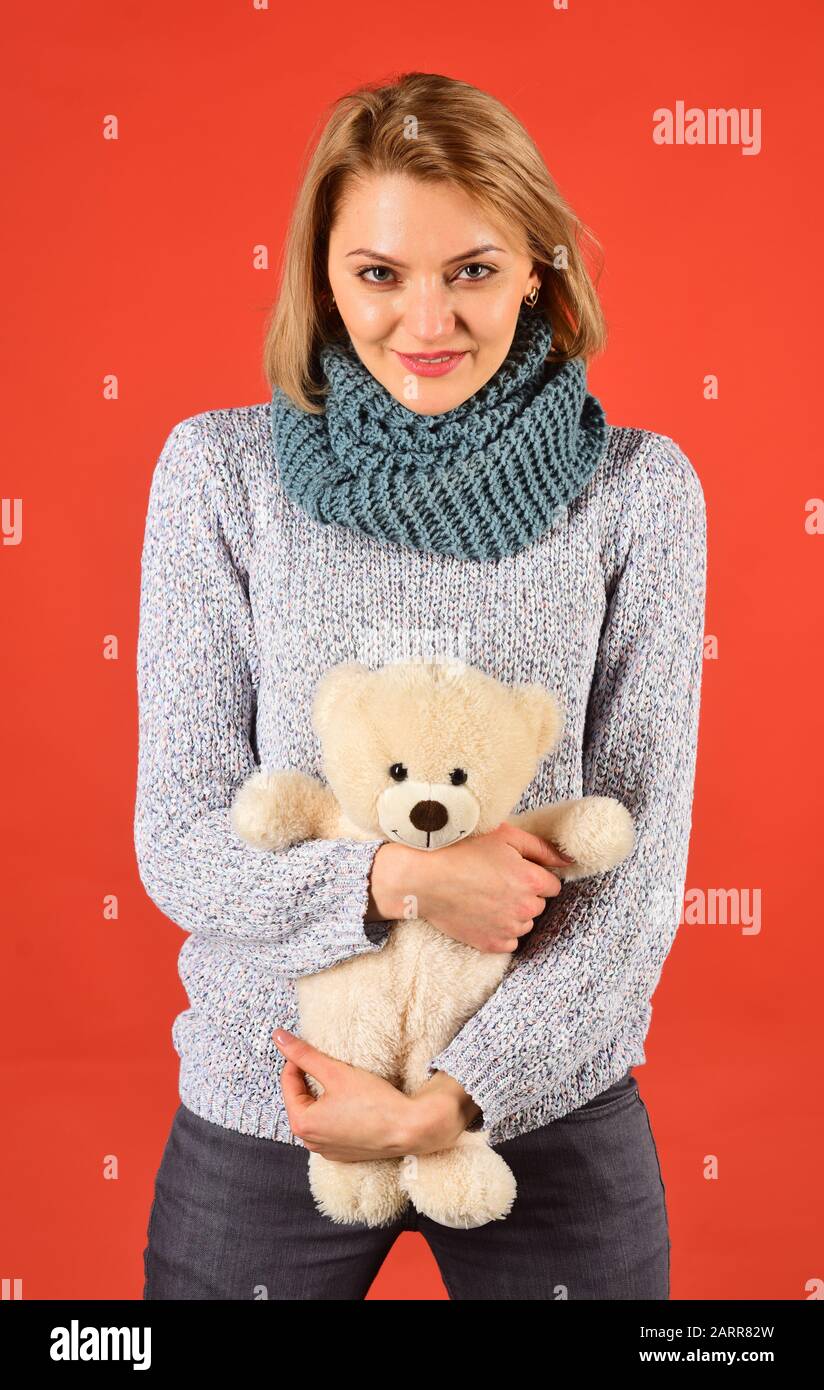 Girl with smiling sticky face plays with white soft toy. Tenderness and ...