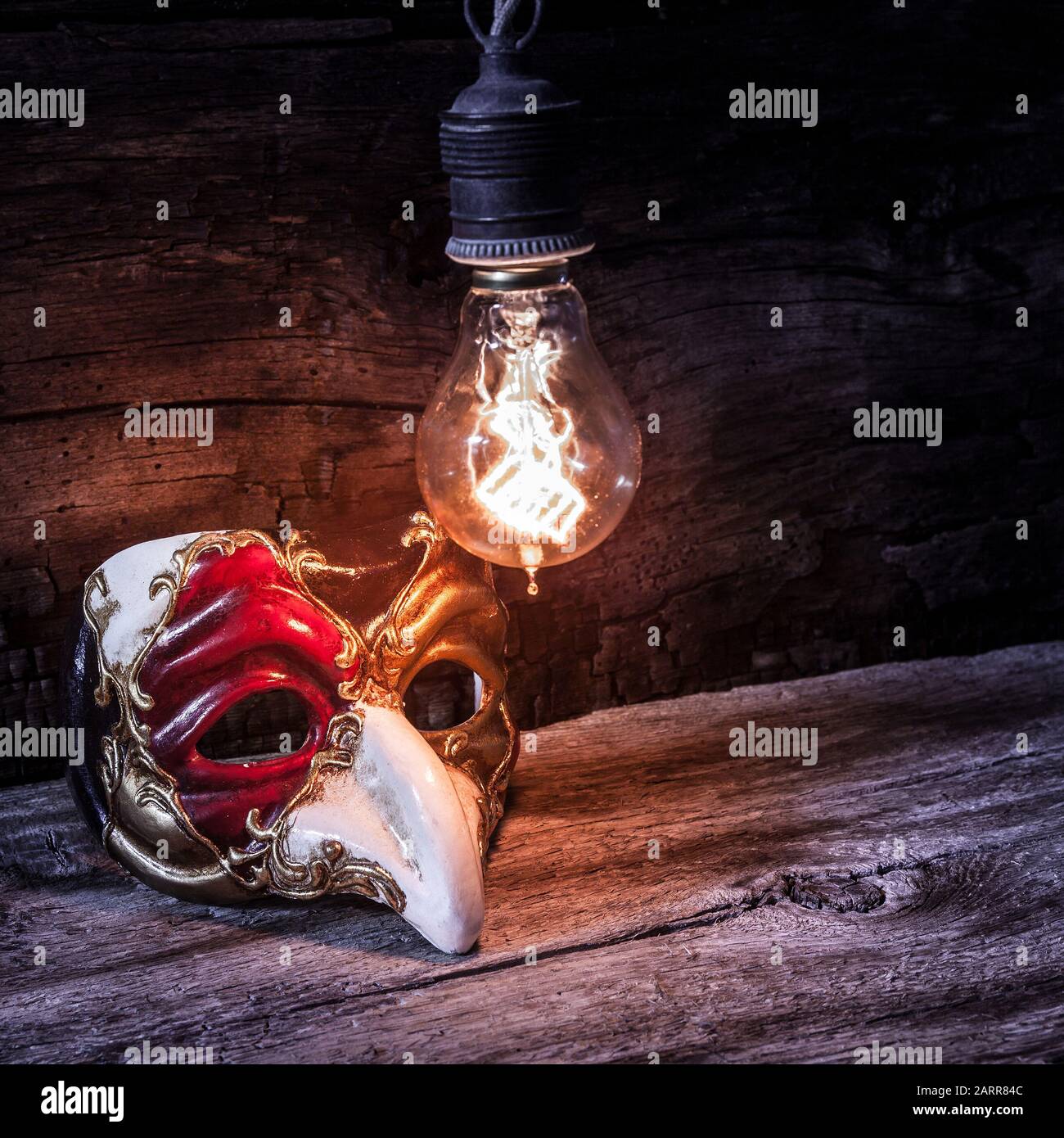 Venice Carnival - Mask with light bulb Stock Photo - Alamy