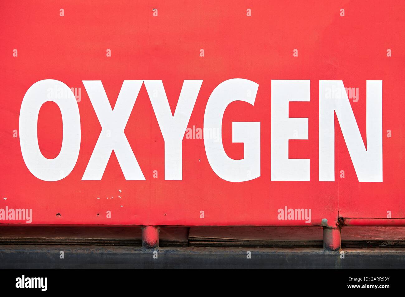 White colored Oxygen signage on a red painted old delivery truck, seen ...