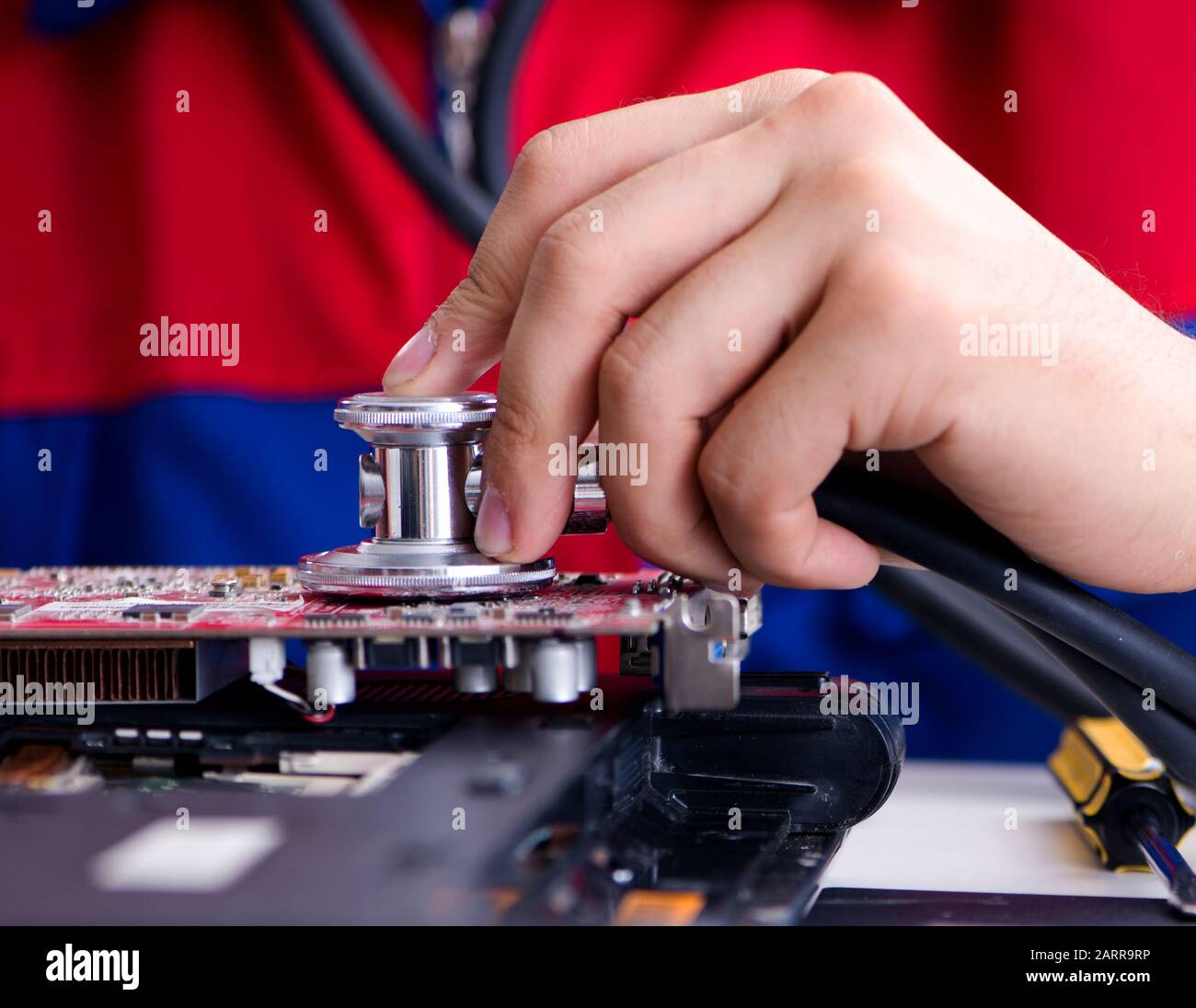 Repairman working in technical support fixing computer laptop ...