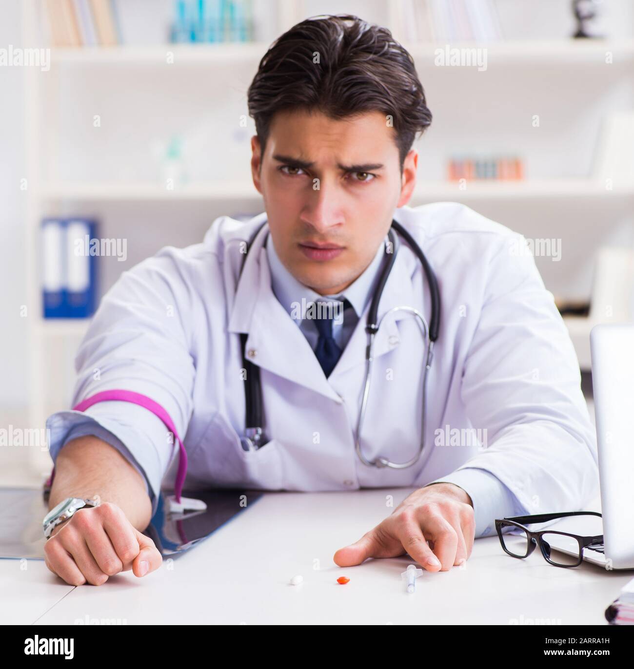 Doctor drug addict in the hospital Stock Photo - Alamy