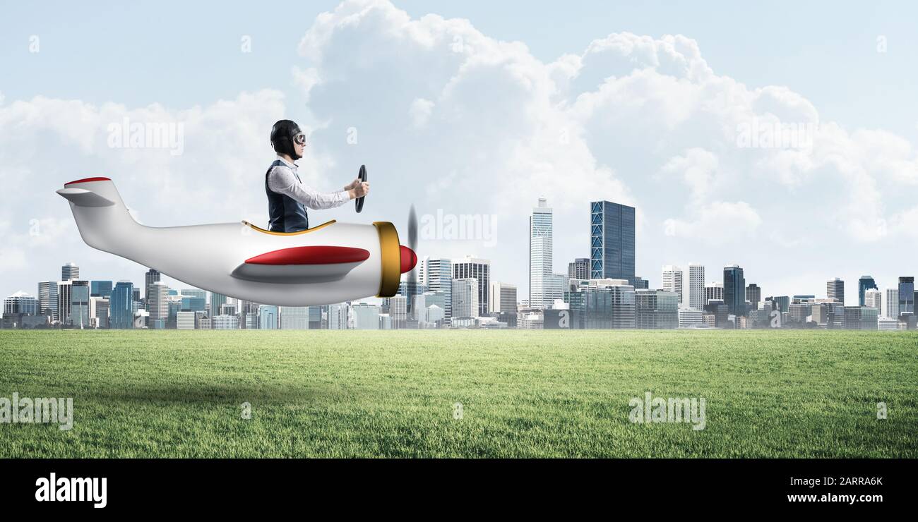Happy aviator driving small propeller plane Stock Photo - Alamy