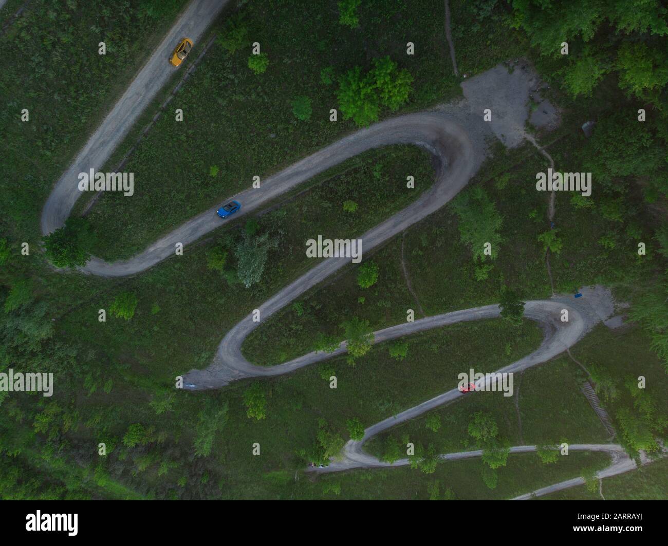Aerial flight over serpentine road hi-res stock photography and images ...