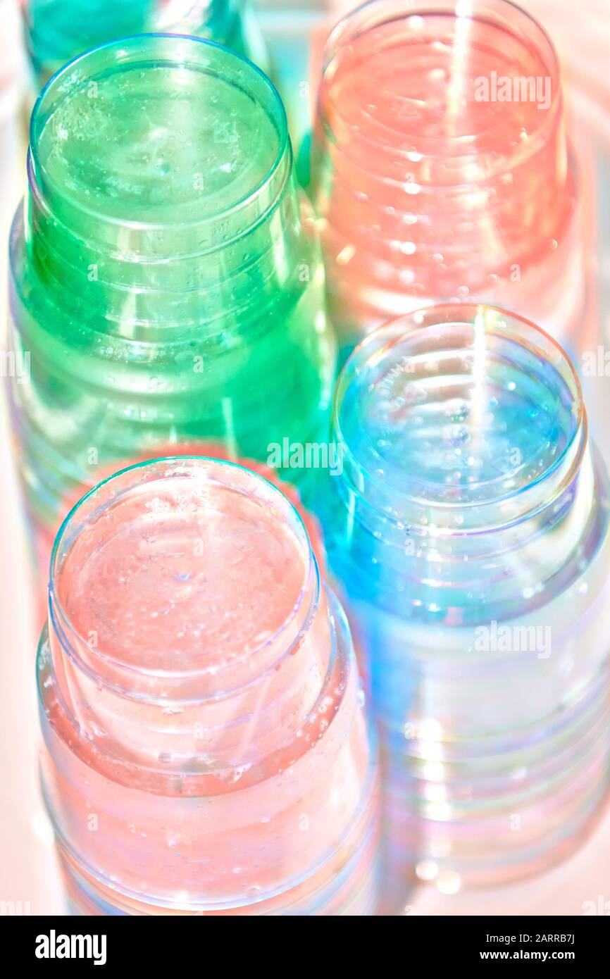 Close-up of piles of pastel colored plastic cups, brightly photographed ...